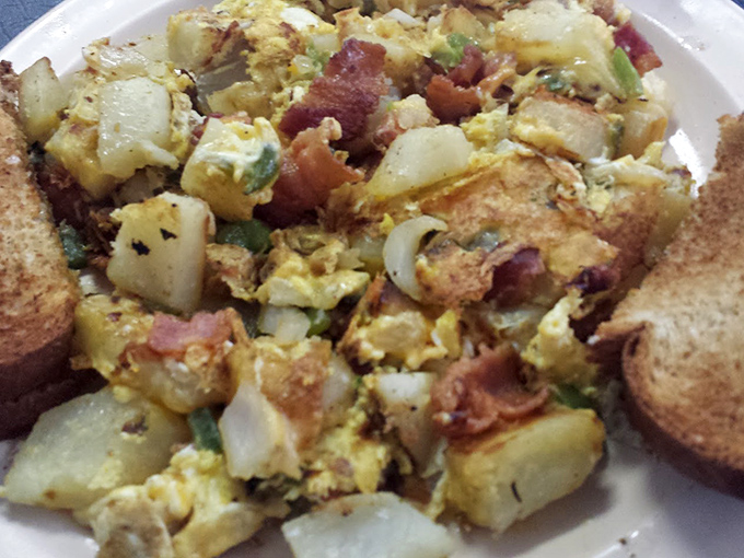 Breakfast of champions: a glorious mess of potatoes, eggs, and meat that would make your cardiologist wince and your taste buds sing.