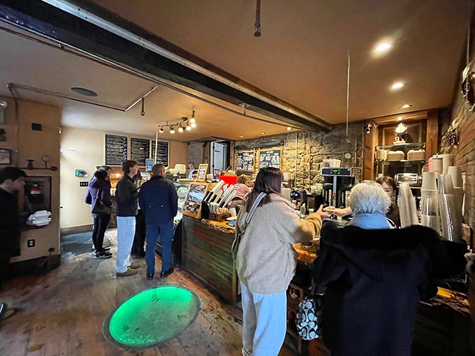 The line forms at the counter where dreams are dispensed one pastry at a time. That circular cutout in the floor adds mystery—perhaps it's where they hide the secret recipes.