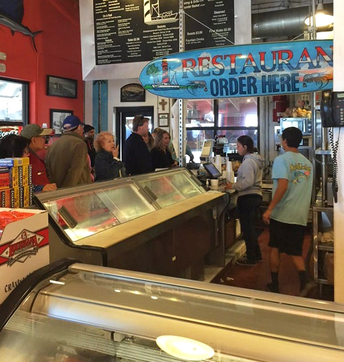 The ordering counter where dreams of fried fish become delicious reality – no fancy reservations needed.