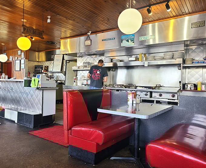 The counter seats—where solo diners find community and everyone gets a front-row view of short-order ballet in motion.