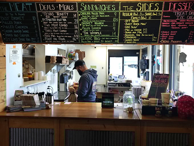Behind this counter, barbecue magic happens daily—like Willy Wonka's factory, but with more smoke and fewer questionable labor practices.