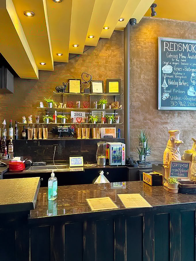 The host station – first stop on your journey to flavor town. Those shelves hold trophies well-earned in the barbecue battlefield.