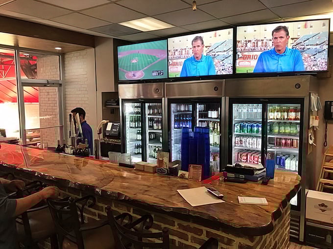 Sports on TV, cold drinks in the cooler, and a live-edge wood bar—the perfect casual backdrop for serious seafood consumption.