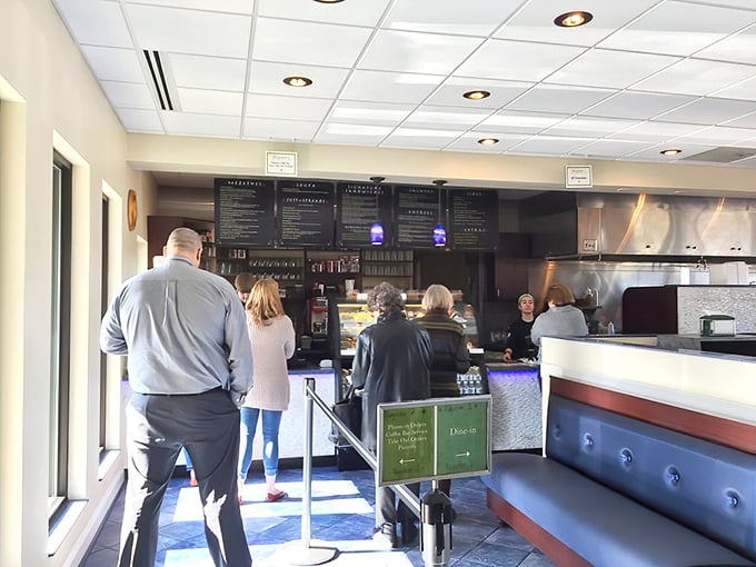 Where culinary dreams begin—the counter where orders are placed and anticipation builds. The menu boards promise Mediterranean treasures.