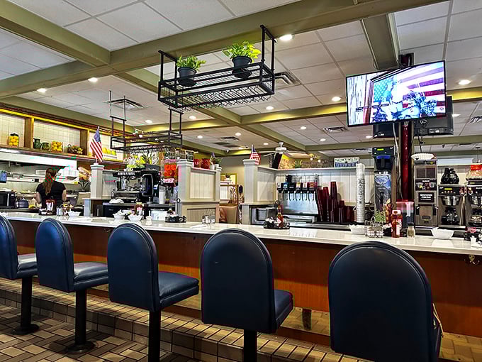 The counter seating—where solo diners become regulars and the coffee refills come with a side of local wisdom.