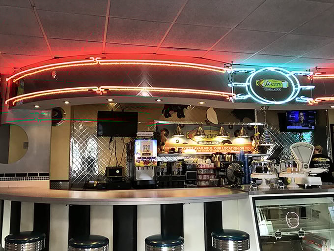 The counter with its vibrant neon lighting isn't just where orders are placed—it's where breakfast dreams come to life under the watchful eye of short-order wizards.