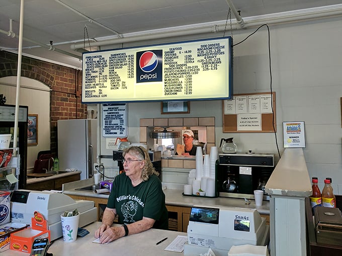 At this counter, culinary magic happens without fanfare—just efficient, friendly service and food that speaks for itself.