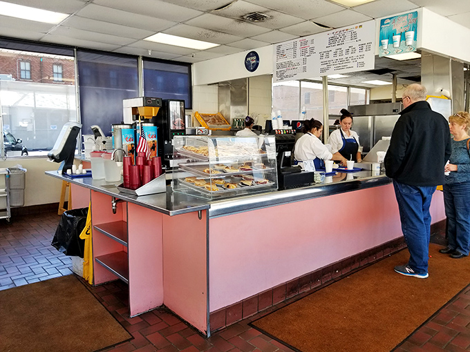 The counter where magic happens – simple, efficient, and staffed by folks who measure experience in decades, not résumé bullet points.