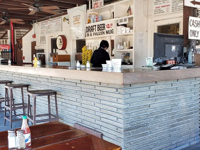 The counter where culinary dreams come true. No fancy digital systems here—just good old-fashioned service with a side of Florida charm. 