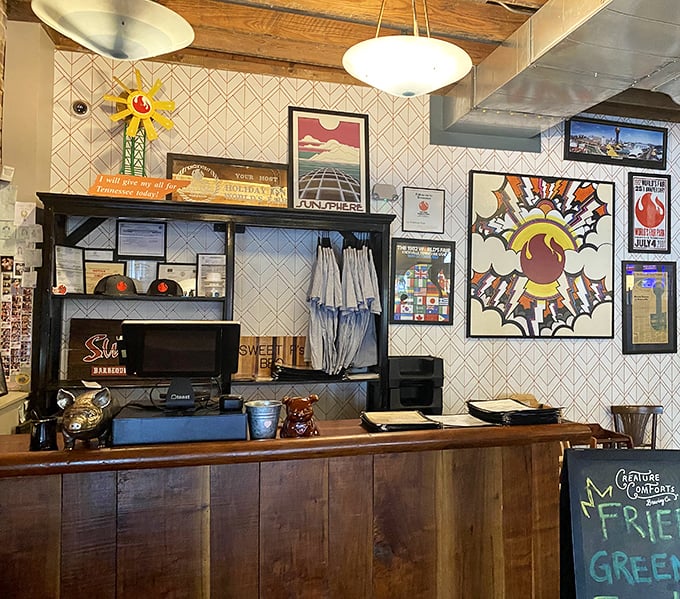 The counter area showcases Sweet P's personality through local art and memorabilia—a visual amuse-bouche before the main event of smoked perfection.