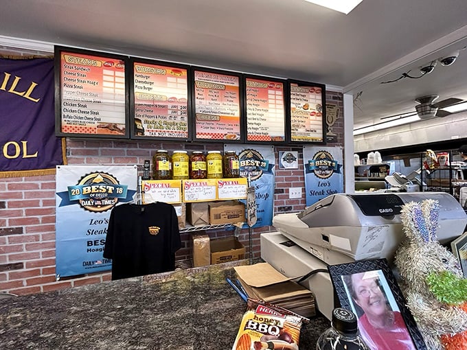 The menu board – a roadmap to satisfaction. Award badges proudly displayed like medals on a general's chest, earned through sandwich excellence.