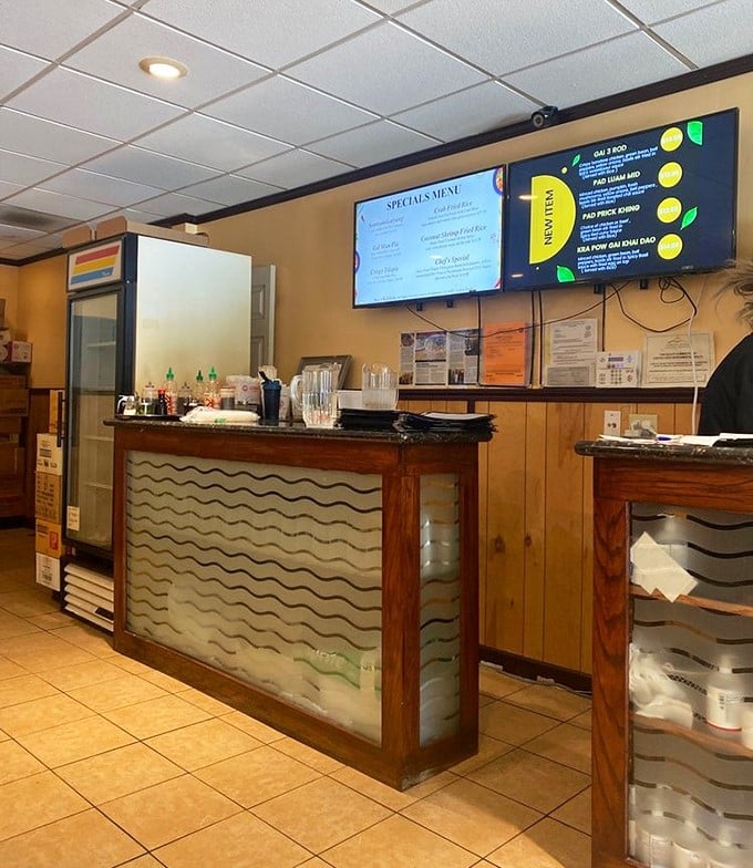 The counter area combines efficiency with warmth – where digital menus meet the personal touch that makes neighborhood restaurants special.