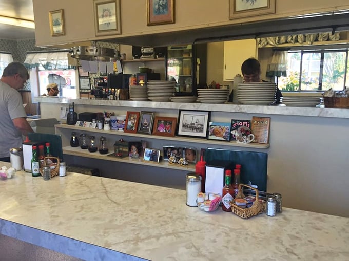 Counter seats where breakfast theater unfolds – better than cable TV and infinitely more satisfying.
