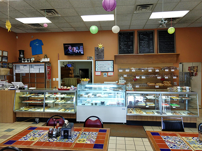 The display case – where dreams are made and diets go to die. Each pastry seems to whisper, "Yes, you deserve me."