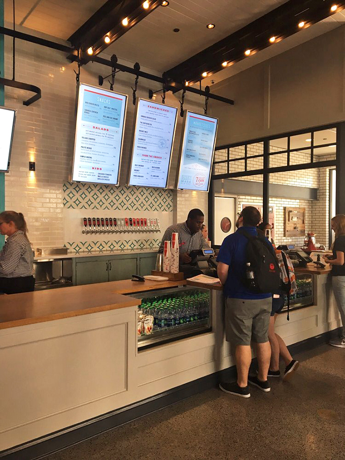Modern efficiency meets barbecue tradition at the ordering counter. Where the magic begins and wallets surrender willingly.