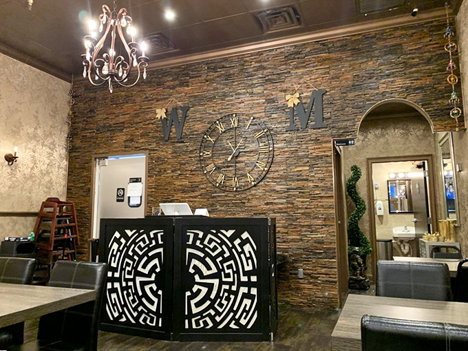 The stone accent wall and artistic clock create a statement entrance. First impressions matter, especially when they involve beautiful design elements.