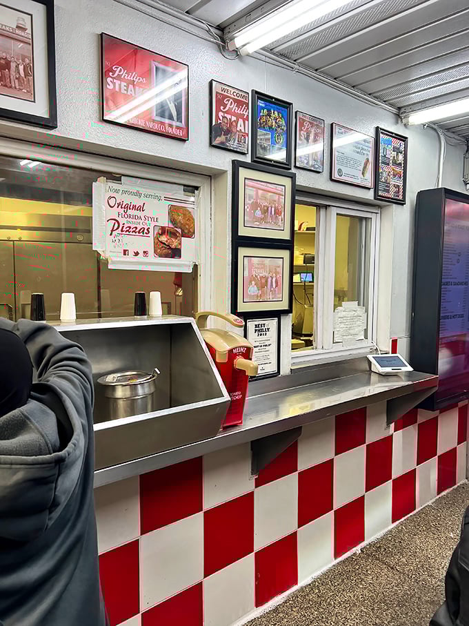 Red and white checkerboard patterns create the visual signature that's become synonymous with Philip's straightforward sandwich excellence.