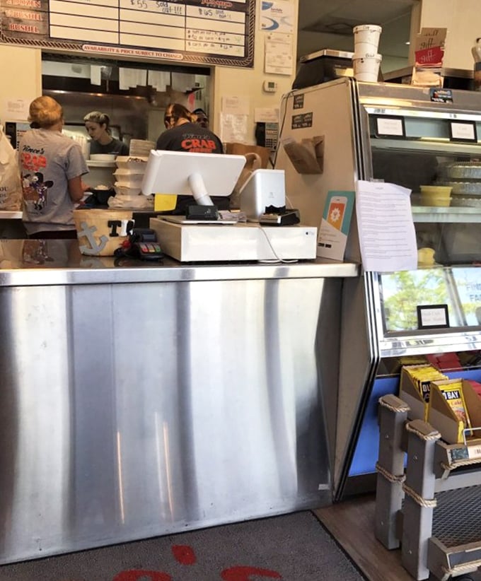 Behind-the-scenes glimpse where the crab magic happens – stainless steel efficiency meets Old Bay dreams.