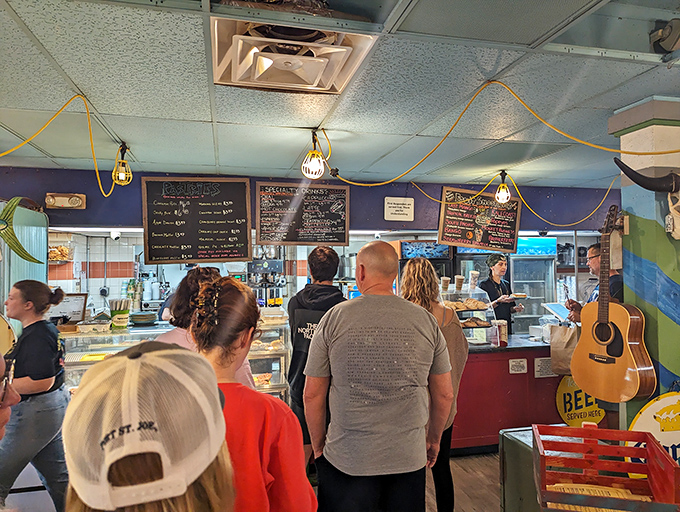 The counter where breakfast dreams come true. That pastry case isn't just displaying food—it's exhibiting edible art with a side of Florida charm.