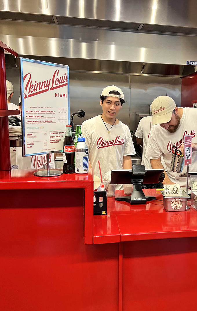 The heart of the operation—a gleaming red command center where burger dreams become delicious reality.