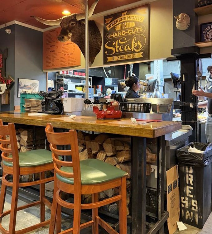 Counter seating: where you can watch BBQ magic happen in real-time. That "Weekend Nights Hand-Cut Steaks" sign isn't just decoration—it's a promise of good things to come.