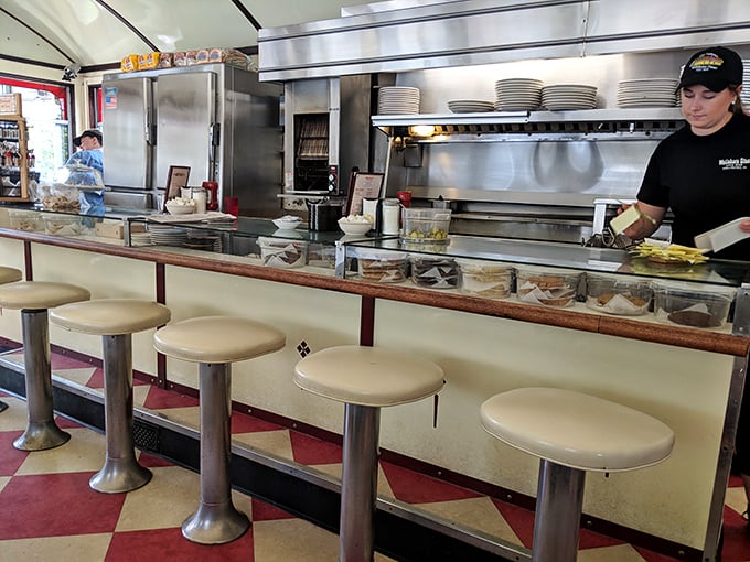These counter stools have witnessed first dates, business deals, and countless "just coffees" over decades—each one a front-row seat to short-order magic.
