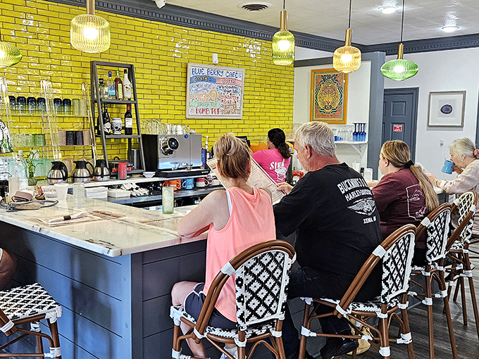 The counter seats offer front-row tickets to the breakfast show, with that stunning yellow brick wall stealing scenes.