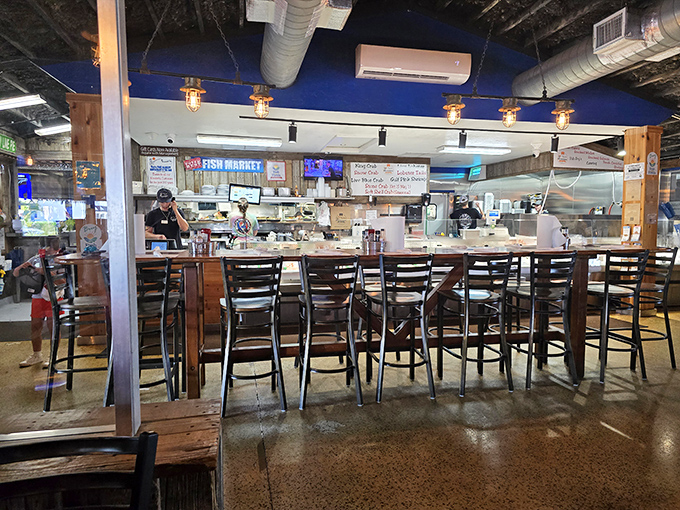 Bar seating offers front-row views of the kitchen action, where the real show happens without any Food Network cameras.