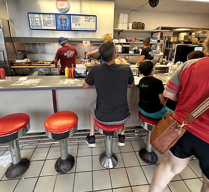 Front-row seats to the greatest show on earth: watching your burger being crafted with the precision of a Swiss watchmaker.