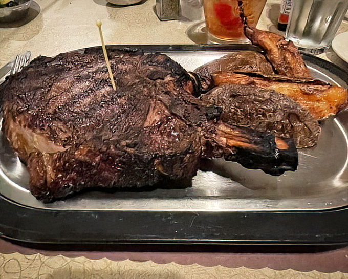 The Cowboy Ribeye isn't just a steak—it's a statement piece, a conversation stopper, and possibly the reason cameras were invented.