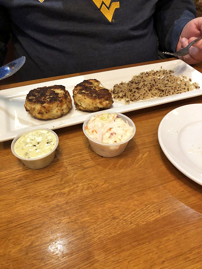 Crab cakes that actually contain crab—revolutionary! These golden discs of seafood joy make a compelling case for moving to the coast.
