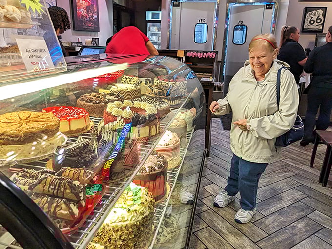 The look of pure joy as a customer contemplates the dessert case—a universal expression that says "diet starts tomorrow."