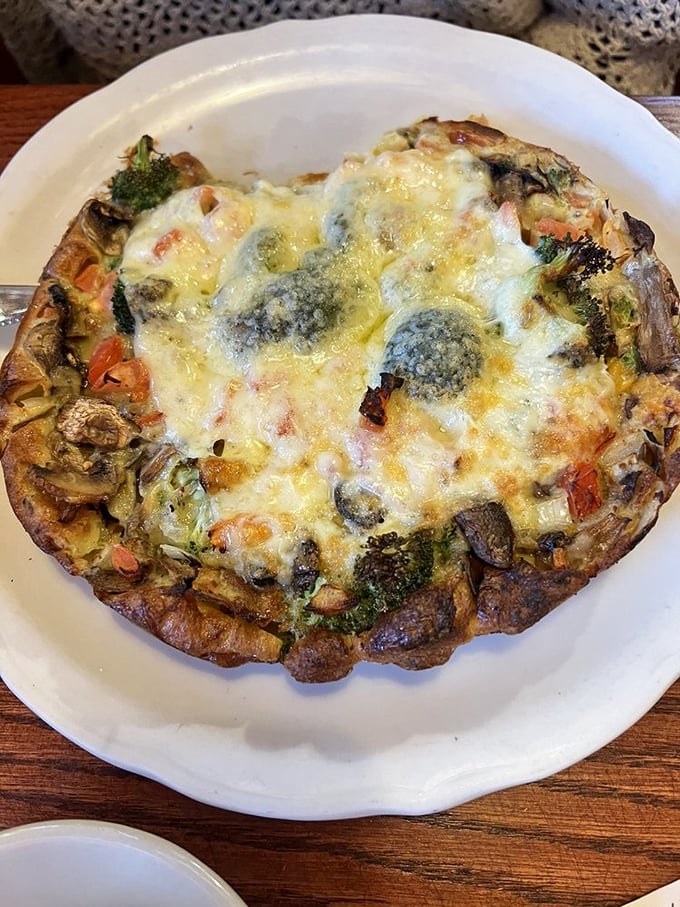 This vegetable-packed omelet proves that healthy can be decadent – a puffy cloud of eggs embracing garden-fresh ingredients under a blanket of cheese.