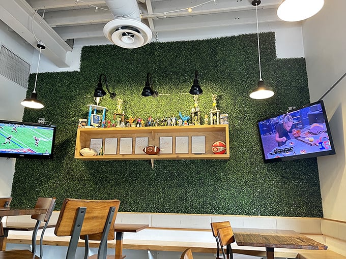 That green wall isn't just décor—it's a statement piece that says, "Yes, we take our chicken seriously, but we're not above having fun with our space."