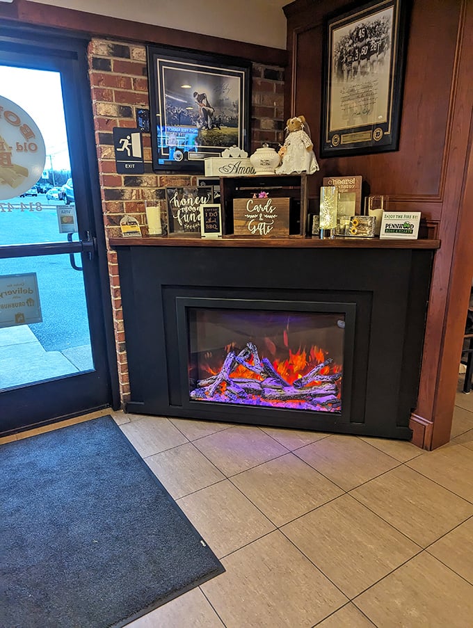 The decorative fireplace by the entrance sets the mood—a visual appetizer that whispers, "You've made a very good decision coming here."