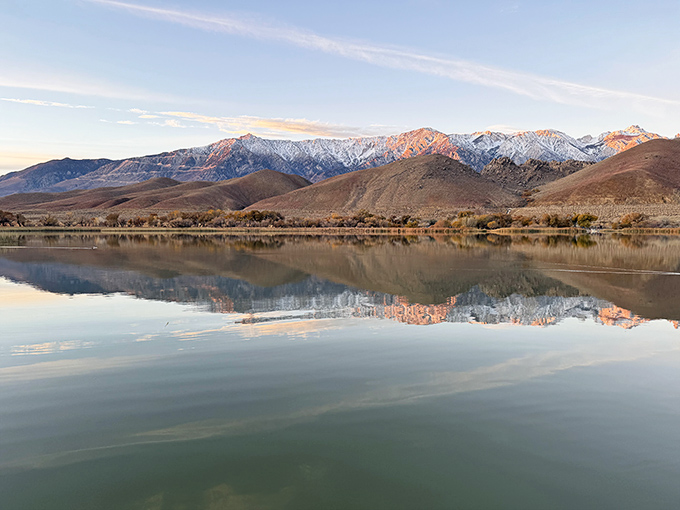 Mirror, mirror on the lake. Diaz Lake captures perfect reflections of the Sierra Nevada, doubling the majesty of dawn's first light.
