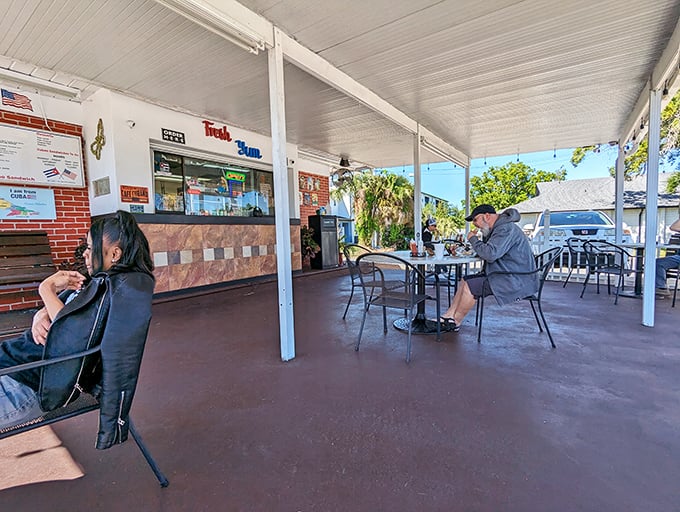 Simple metal chairs and tables create the perfect stage for the real star of the show—that sandwich you're about to demolish.