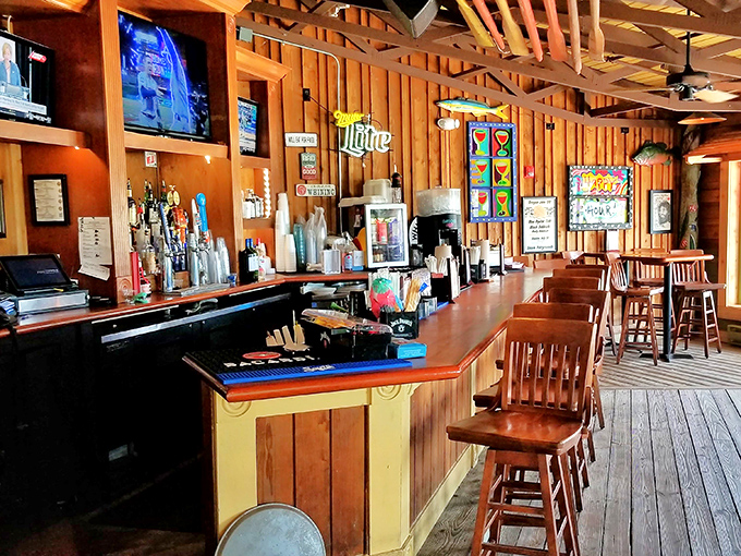 The bar at Floyd's isn't just serving drinks – it's dispensing coastal happiness in glasses rimmed with salt and nostalgia.