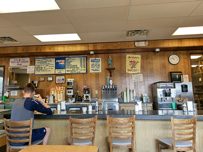 Counter seating that invites lingering conversations over coffee and the day's freshest sweet temptations.
