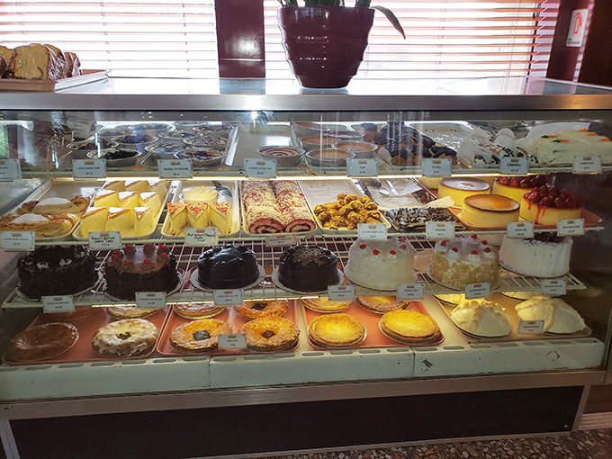 The dessert case—where willpower goes to die and "I'll just have coffee" turns into "and a slice of everything."
