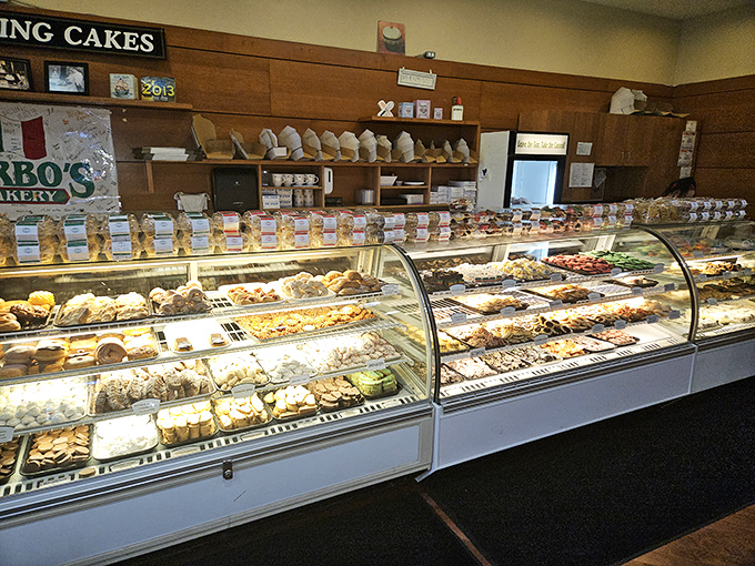 A display case that should come with a warning label: "Caution: May cause spontaneous dessert decisions and sugar-induced euphoria."