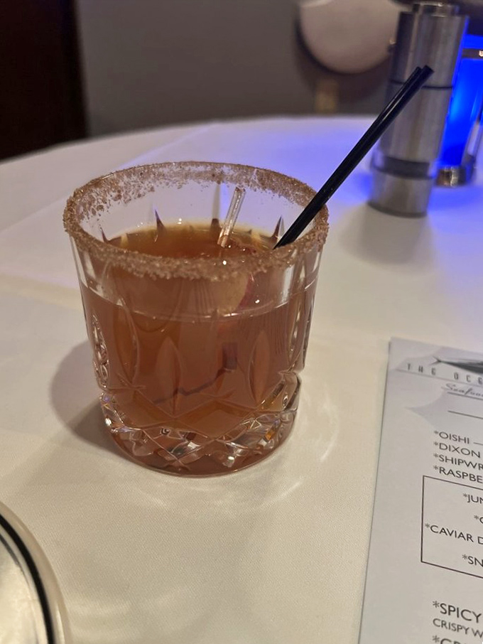 A perfectly crafted cocktail with a sugar-rimmed edge—because sometimes your drink deserves to dress up as much as you do.