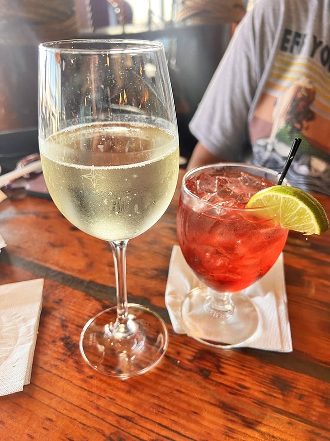 Wine and a sunset-colored cocktail—because sometimes the perfect pairing for seafood is liquid sunshine with a twist of lime.