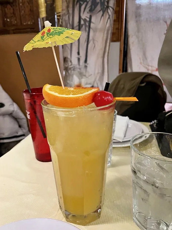 Not just a drink—it's vacation in a glass. That tiny umbrella isn't ironic; it's a promise of the mini-getaway that follows with each sip.