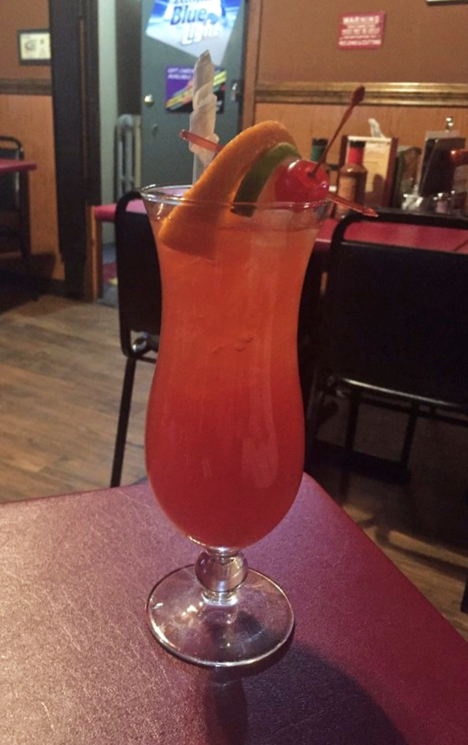 Even the cocktails at Grumpy's bring the heat, with this hurricane-style drink offering a fruity counterpoint to all that savory smoke.