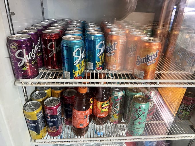 
The drink selection rivals the album wall for variety—because proper hydration is essential when embarking on a serious barbecue adventure.
