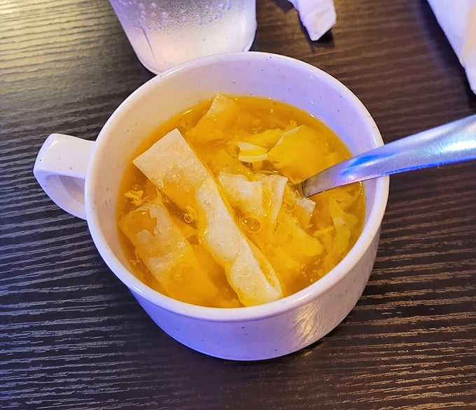 Egg drop soup—comfort in a cup. Those ribbons of egg floating like golden scarves in a savory broth.