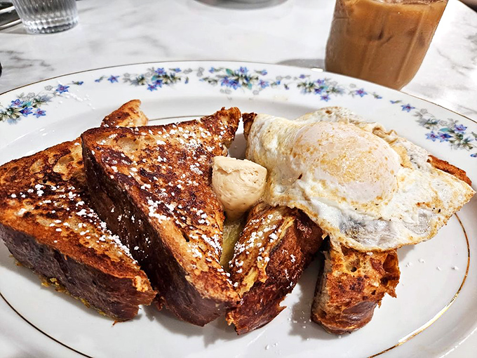 French toast that's achieved the impossible dream: crispy exterior, custardy interior, and the power to make you forget every other breakfast commitment.