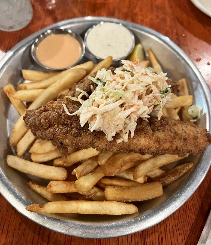 Crispy catfish and golden fries with slaw that doesn't know whether it's a garnish or a co-star—either way, it steals scenes.