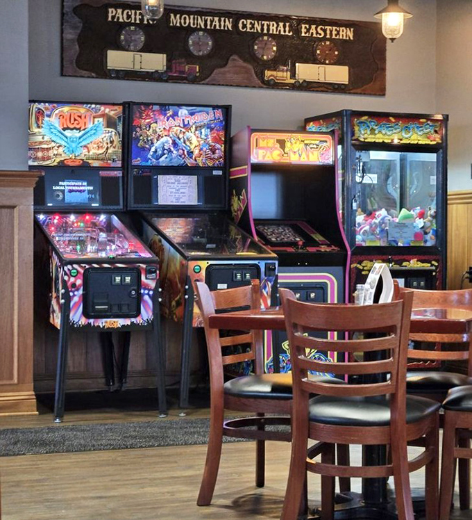 Classic arcade games waiting for quarters and nostalgia. Where parents suddenly remember skills they haven't used since Reagan was president.